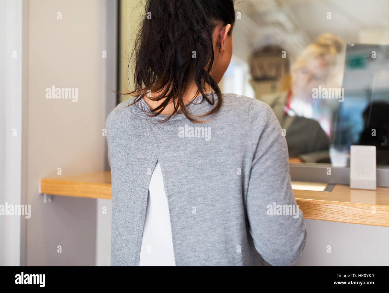 customer at bank office or currency exchanger Stock Photo - Alamy