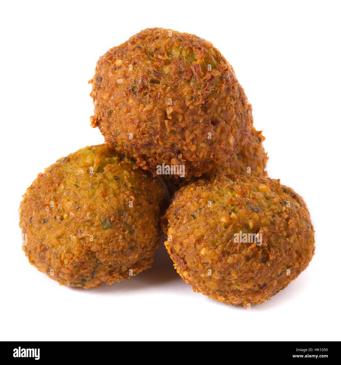 three whole falafel isolated on white background Stock Photo - Alamy
