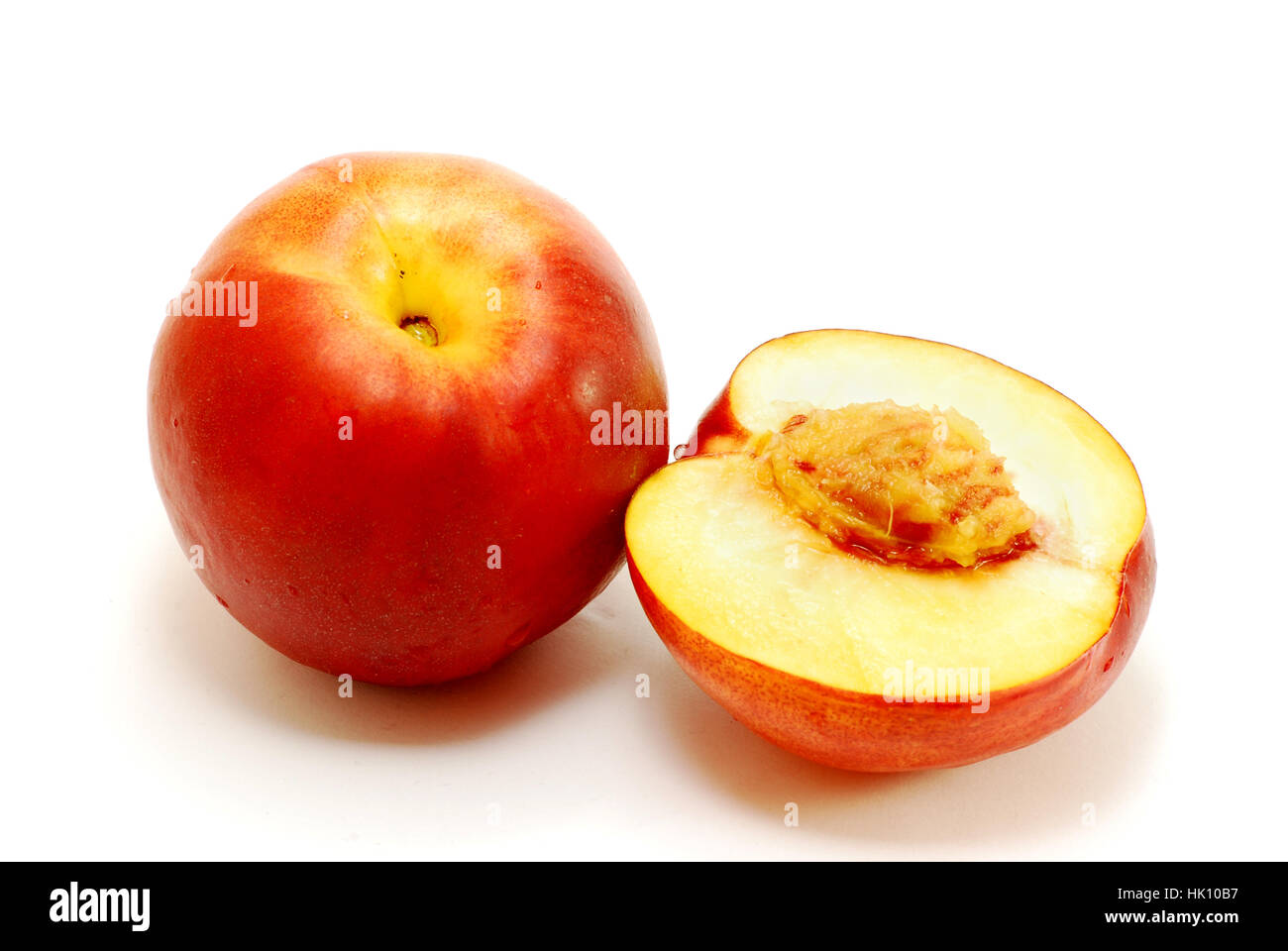 Ripe red peaches isolated Stock Photo - Alamy