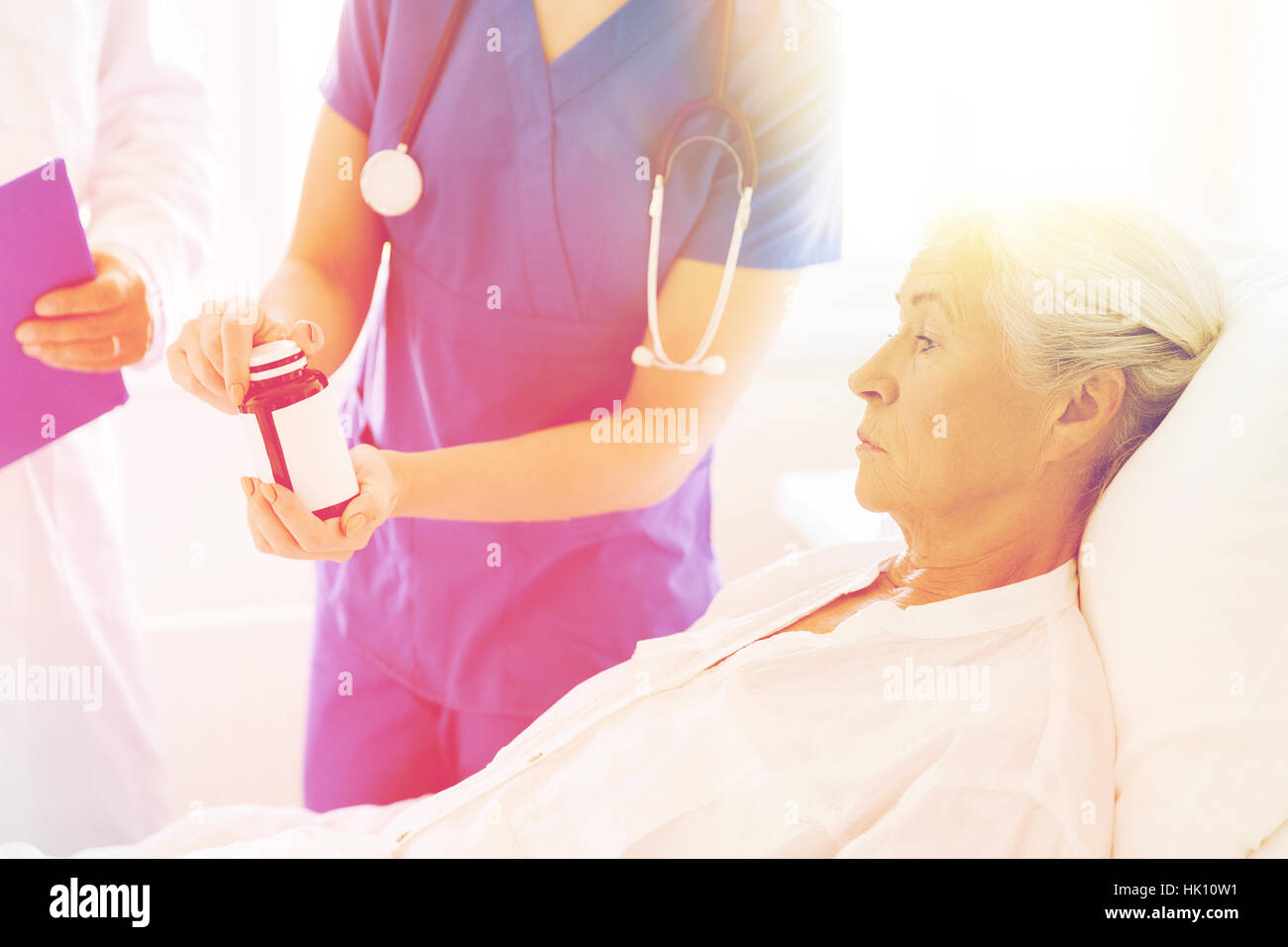 doctor giving medicine to senior woman at hospital Stock Photo - Alamy