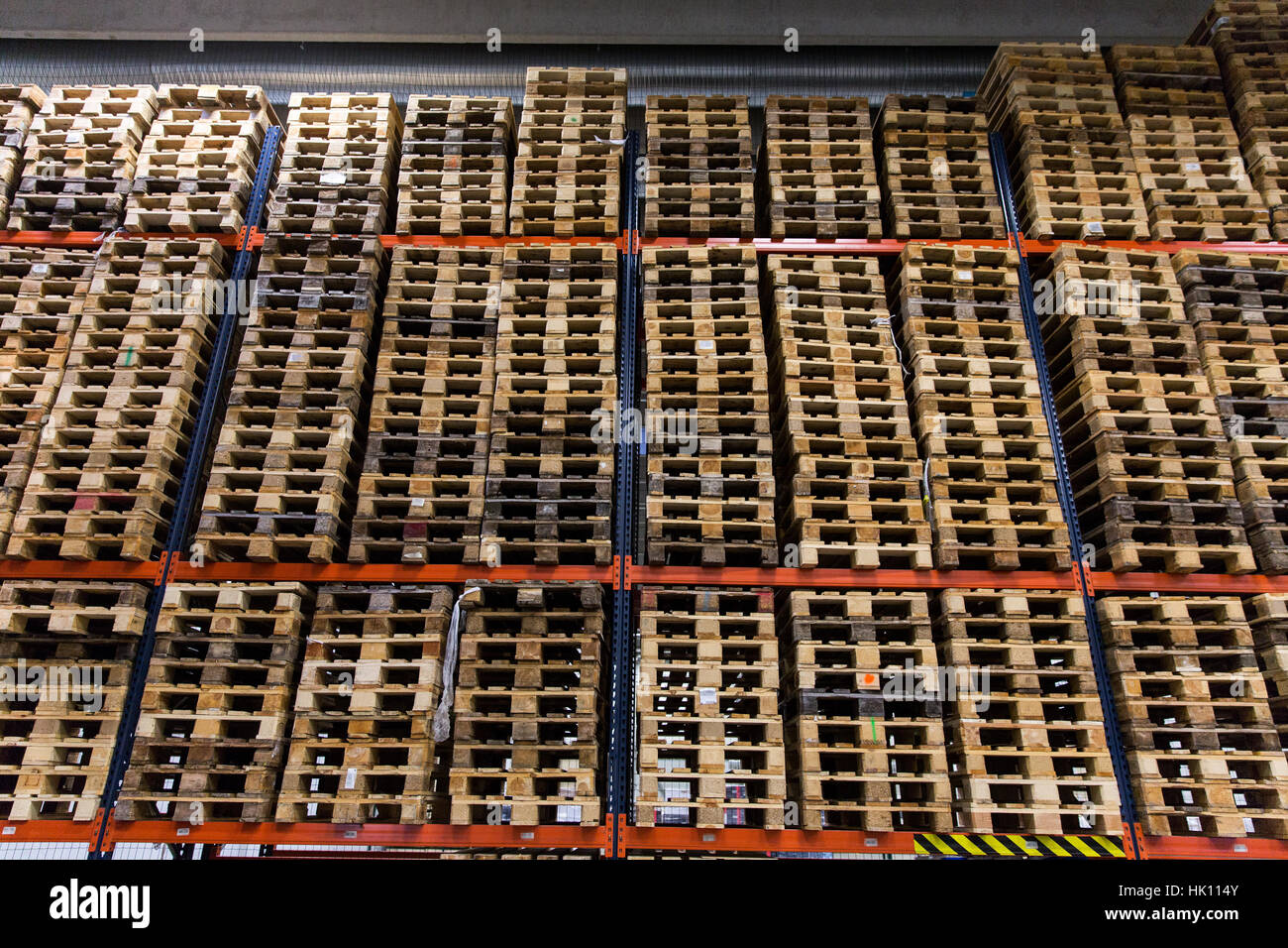 wooden cargo pallets storing at warehouse shelves Stock Photo - Alamy