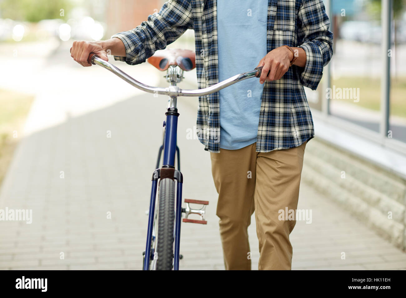 Man walking with cycle hi-res stock photography and images - Alamy