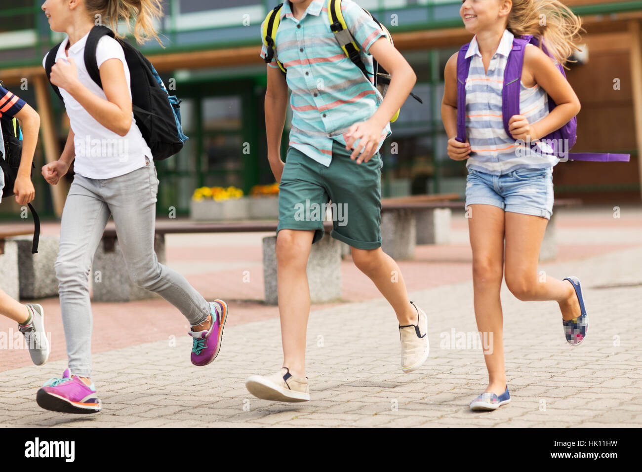 group of happy elementary school students running Stock Photo - Alamy