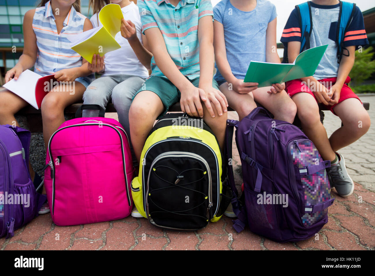 students with school backpacks and notebooks Stock Photo - Alamy