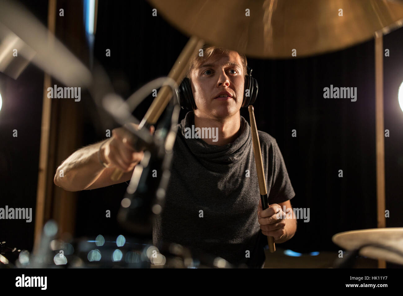 male musician playing drums and cymbals at concert Stock Photo - Alamy