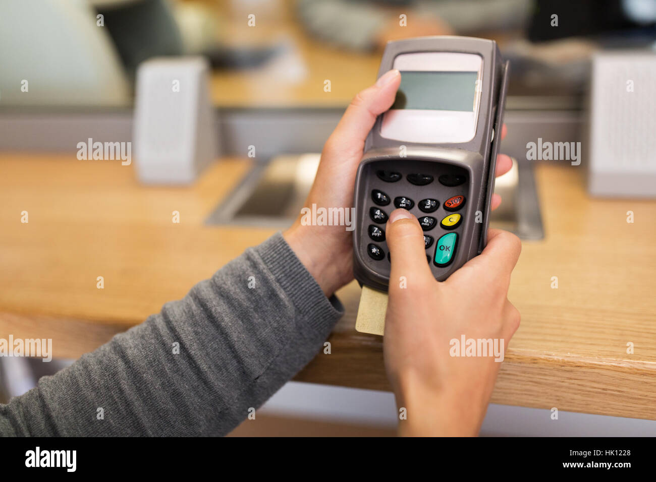 hand entering pin code to card reader terminal Stock Photo - Alamy