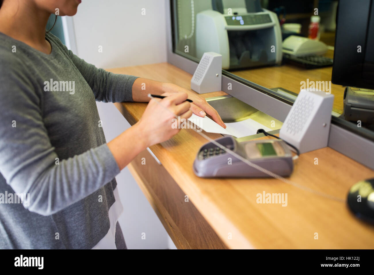 customer writing application at bank office Stock Photo - Alamy