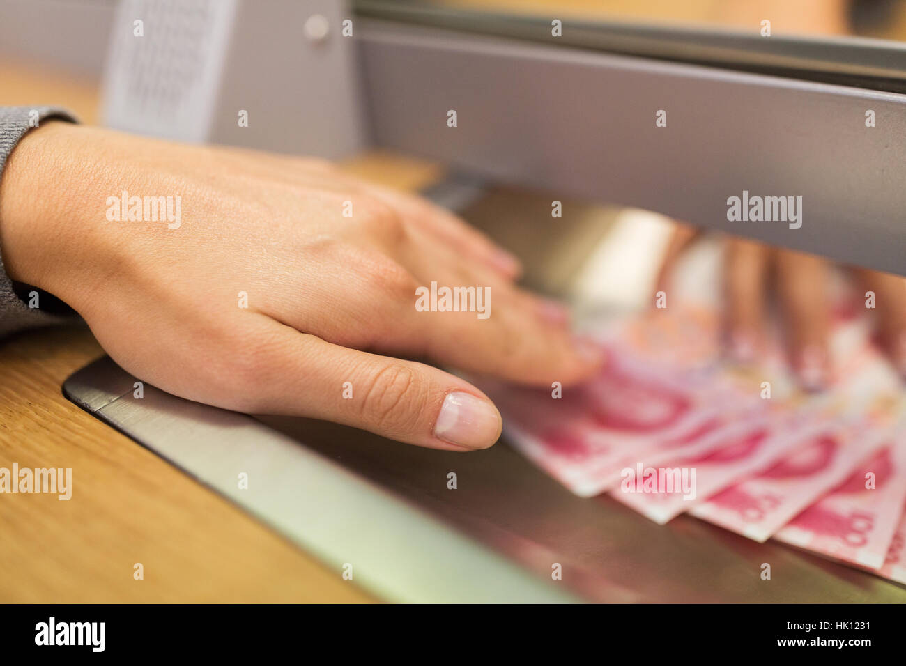 clerk giving cash money to customer at bank office Stock Photo - Alamy