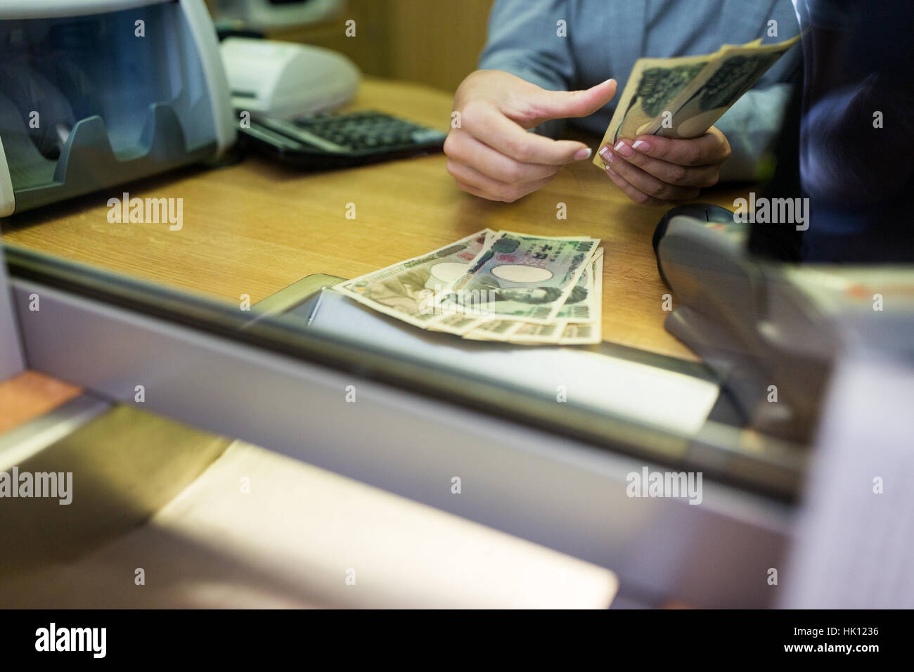 clerk counting cash money at bank office Stock Photo - Alamy