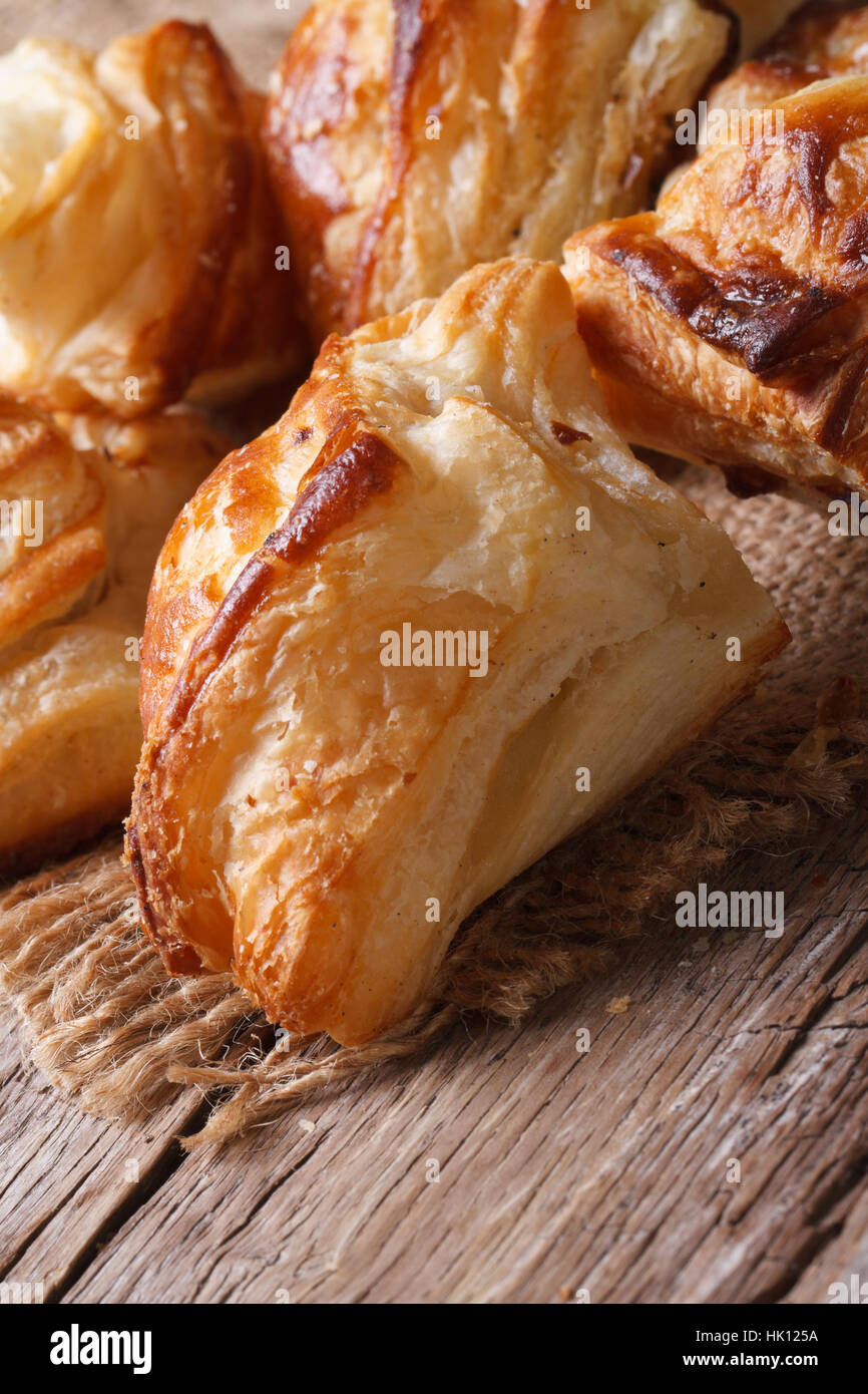 Pies of puff pastry close up on an old table. vertical Stock Photo - Alamy