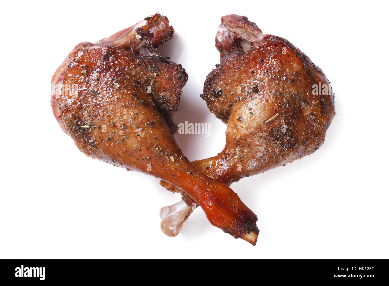 two fried duck legs isolated on white background close up horizontal ...