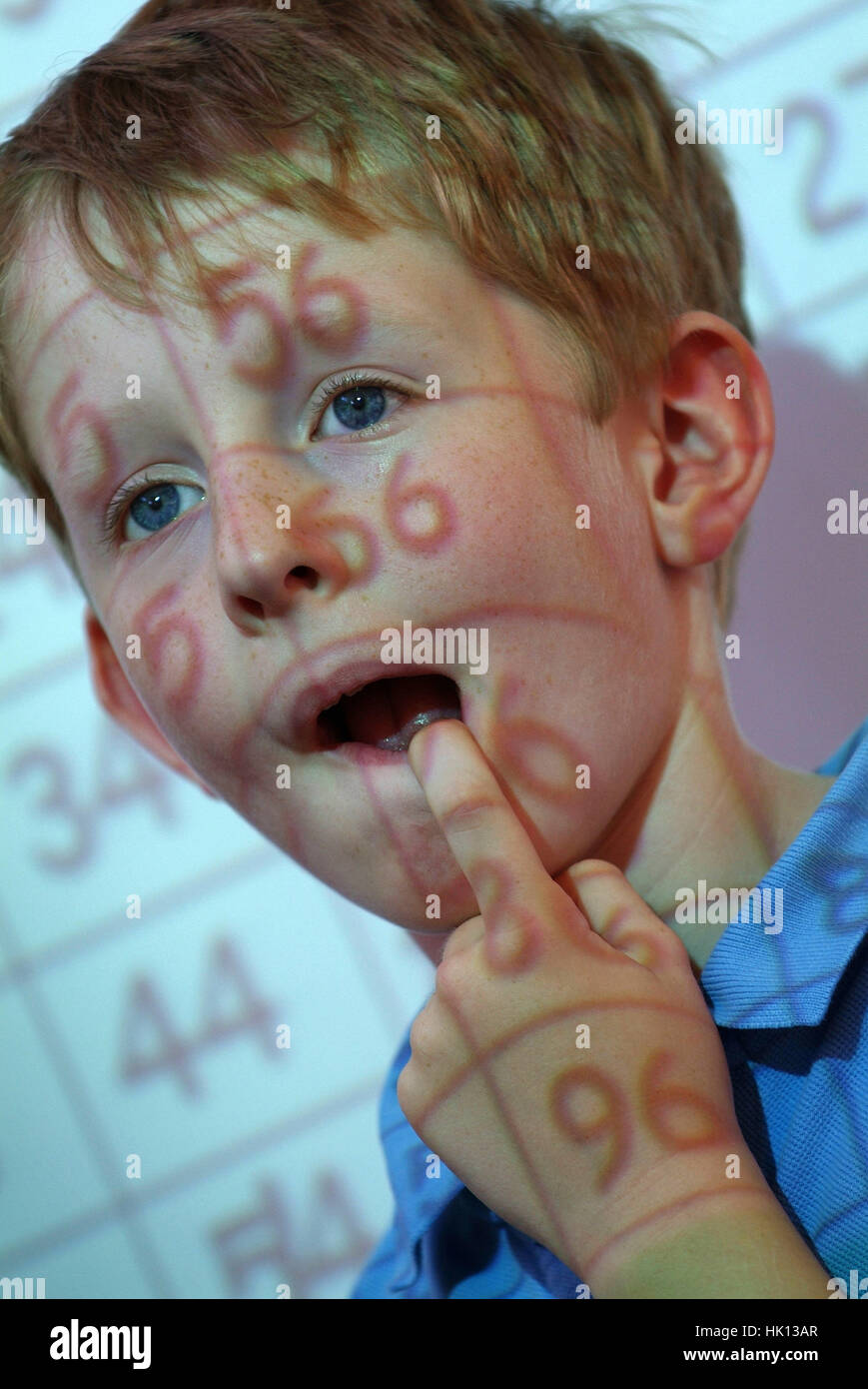 Primary School students using computers and in a mathematics lesson ...