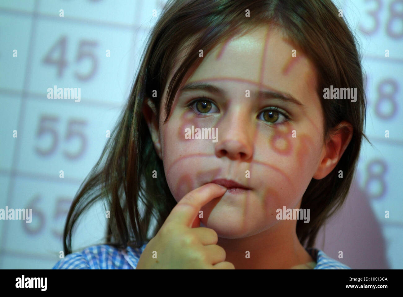 Primary School students using computers and in a mathematics lesson ...