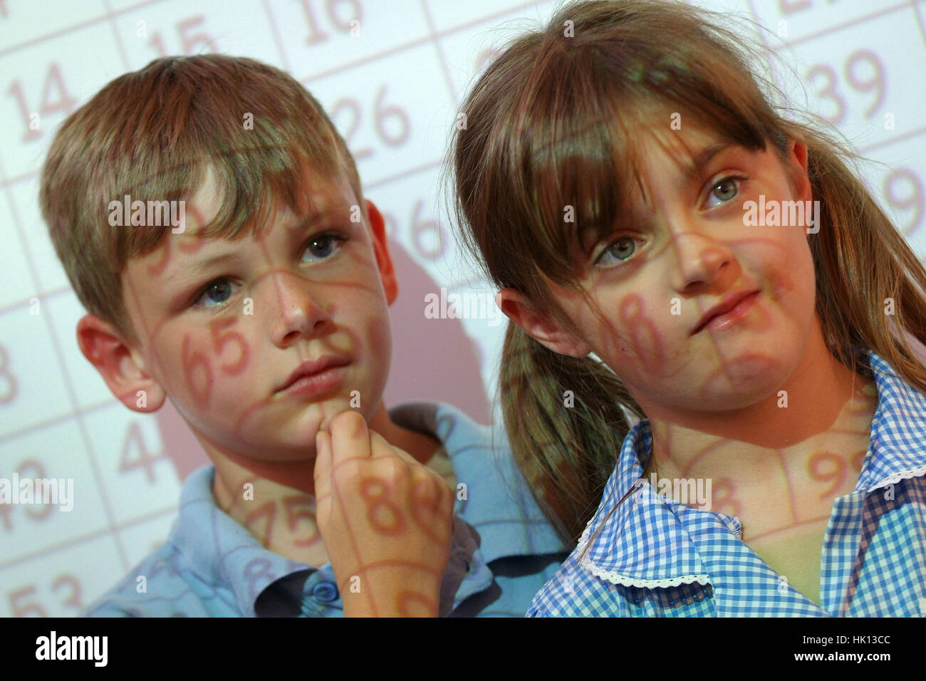 Primary School students using computers and in a mathematics lesson ...