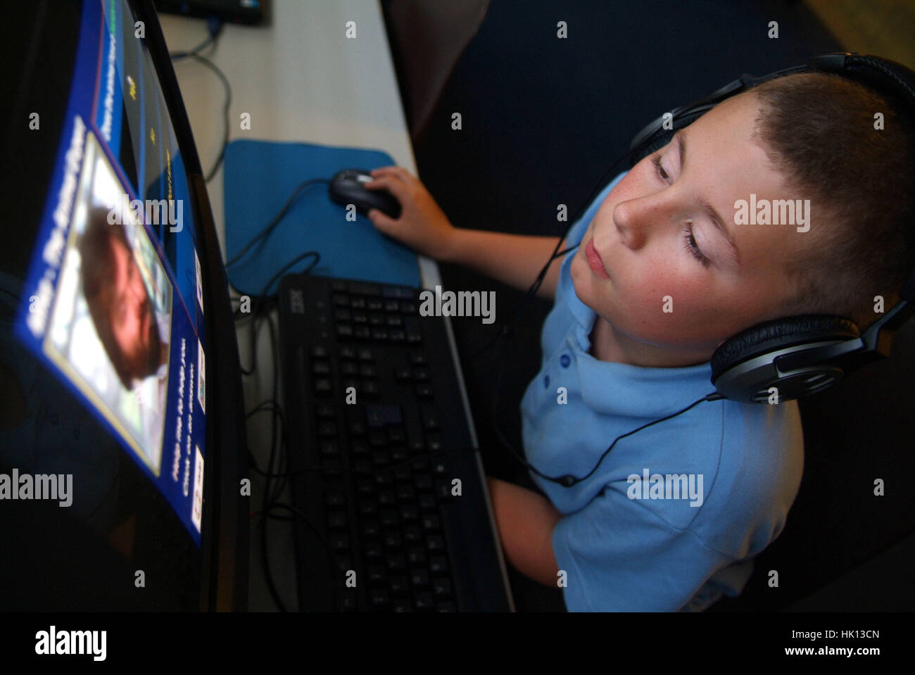 Primary School students using computers and in a mathematics lesson ...