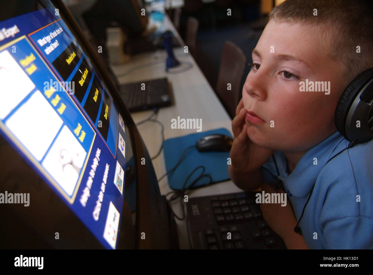 Primary School students using computers and in a mathematics lesson ...