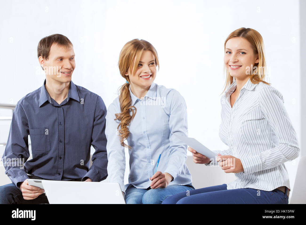 Three co workers at the office hi-res stock photography and images - Alamy