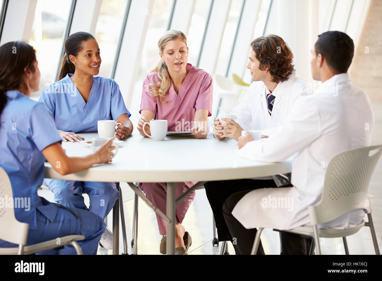 Medical Staff Chatting In Modern Hospital Canteen Stock Photo - Alamy