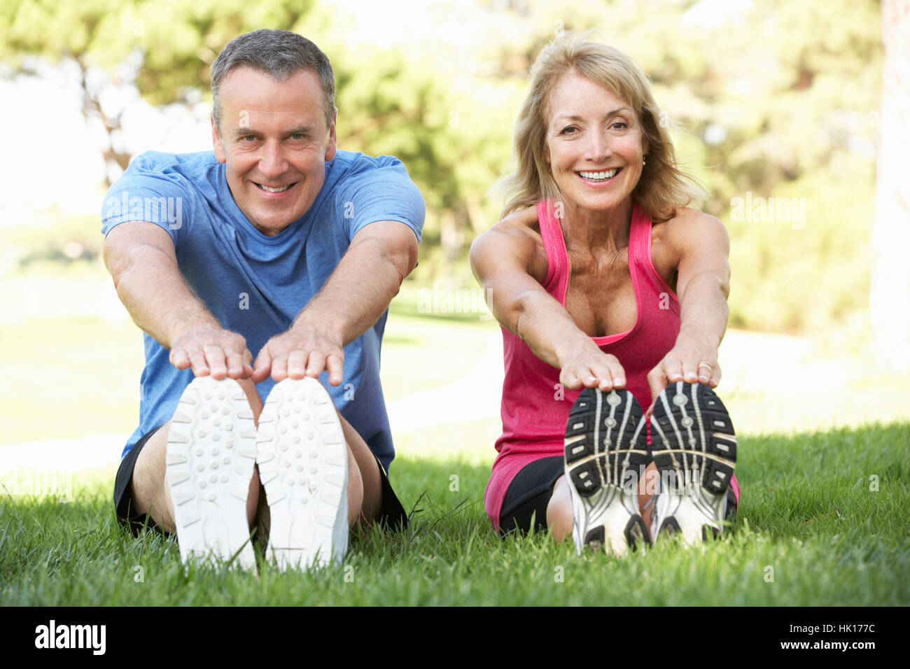 Senior Couple Exercising In Park Stock Photo - Alamy