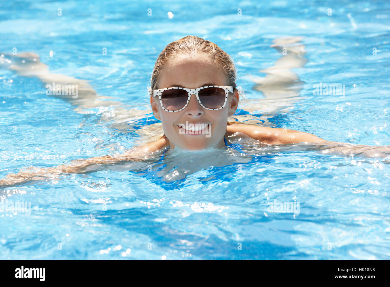 Woman Swimming In Pool Stock Photo - Alamy