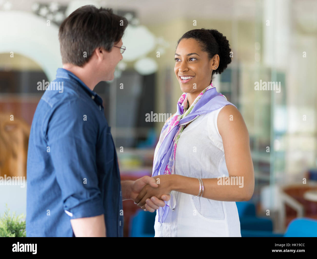 Young professionals shaking hands hi-res stock photography and images ...