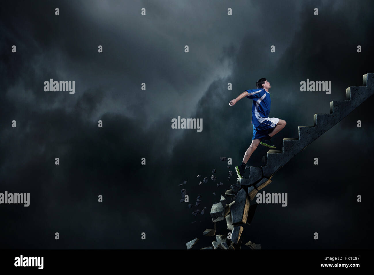 Sports active man running on stone collapsing ladder hi-res stock ...