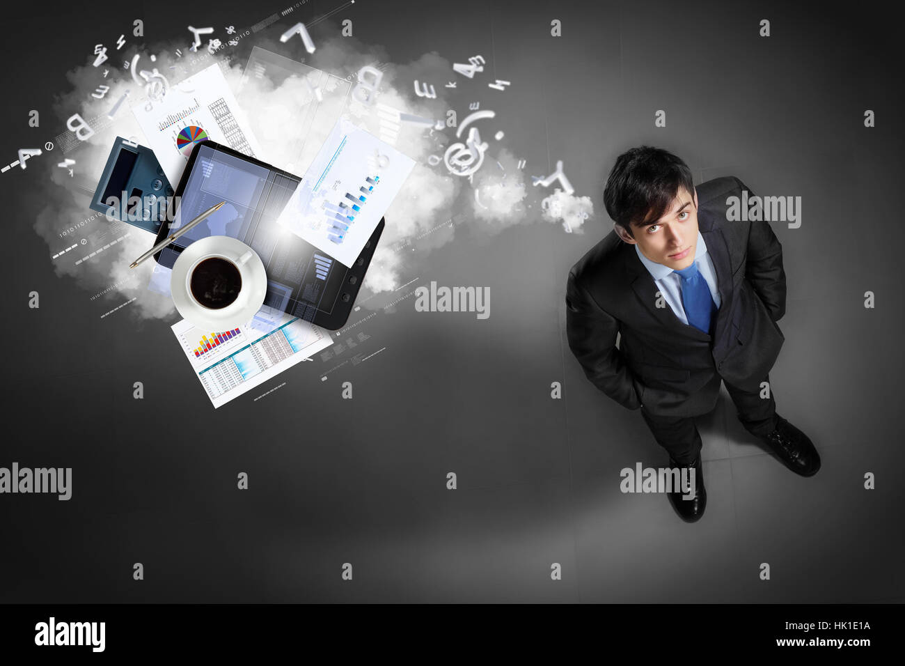 Image of business objects flying in air top view against businessman ...