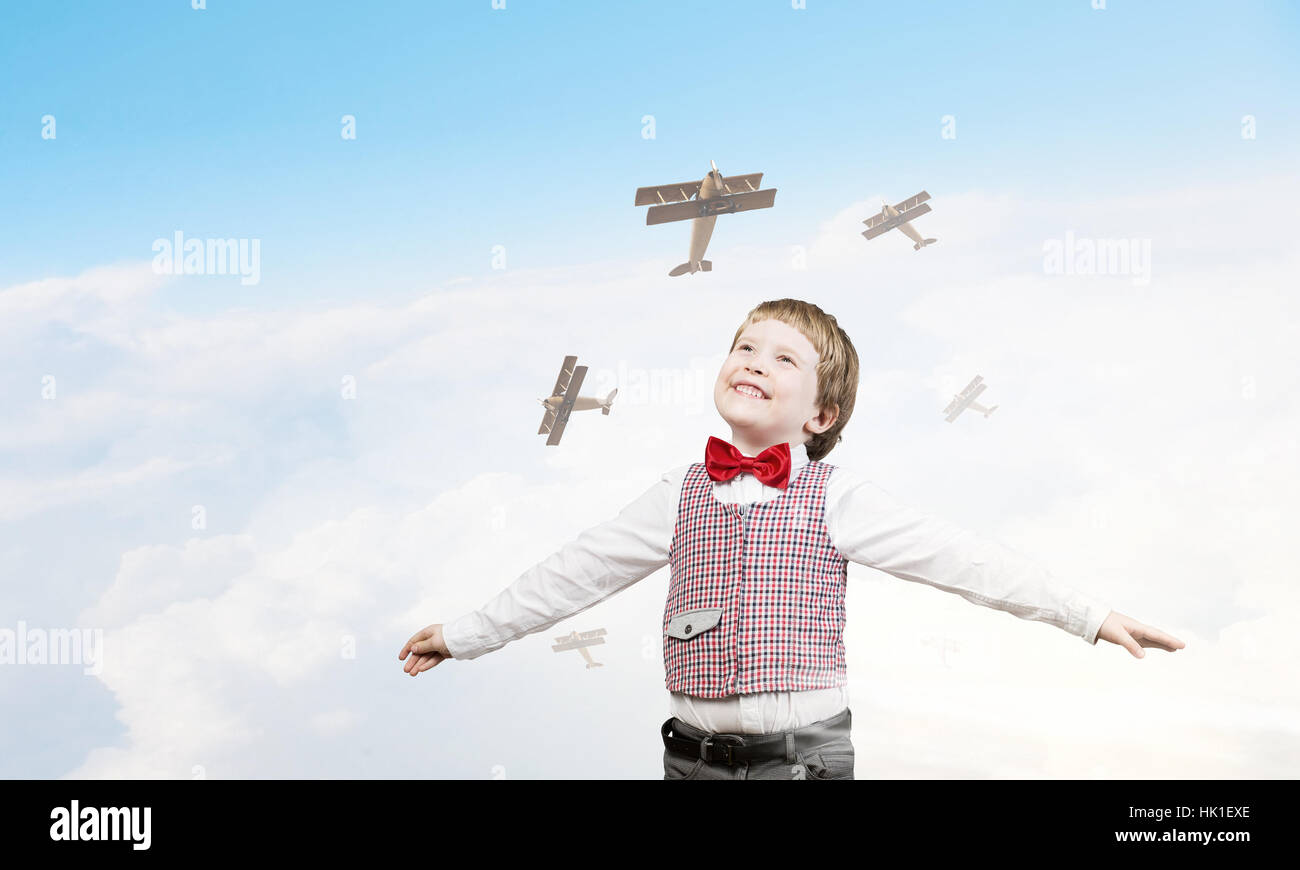 Happy kid boy with hands spread imagine he is flying Stock Photo - Alamy