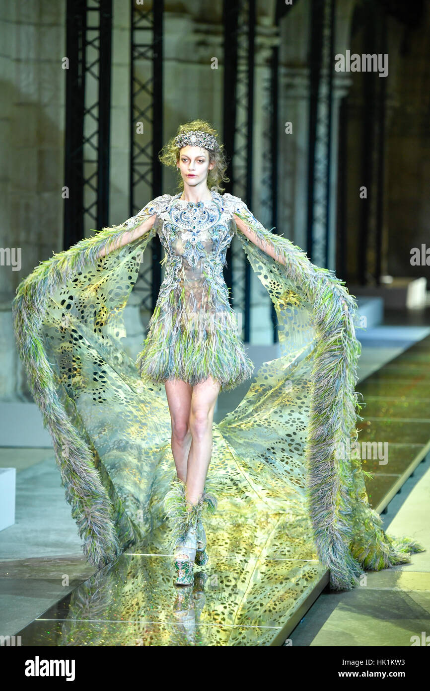 Paris, France. 25th Jan, 2017. A model presents a creation of Guo Pei's ...