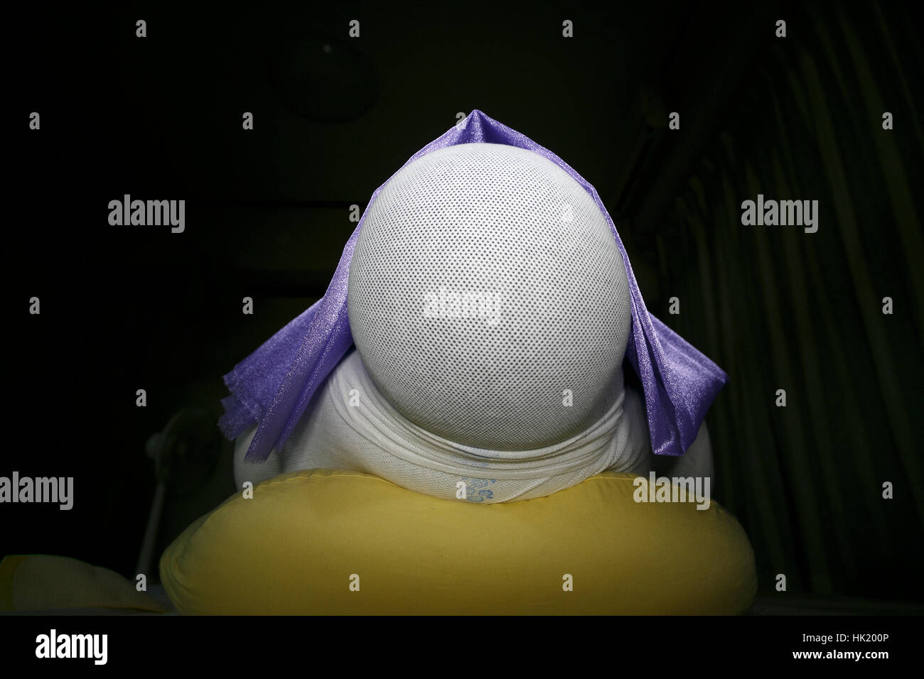 Tokyo, Japan. 4th Feb, 2017. A man in darkness is wrapped in cloth ...