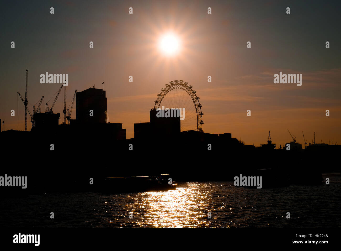 The sun sets over London's iconic skyline Stock Photo - Alamy