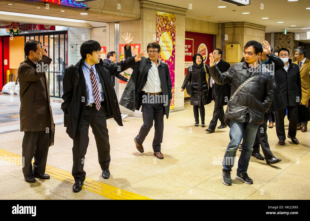 Friends saying goodbye shinjuku railway hi-res stock photography and ...