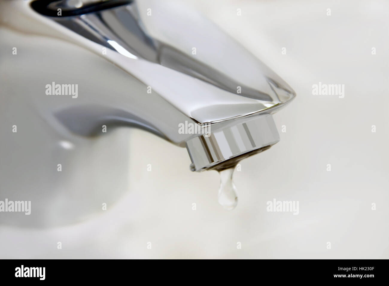 a drop of water from a tap Stock Photo - Alamy