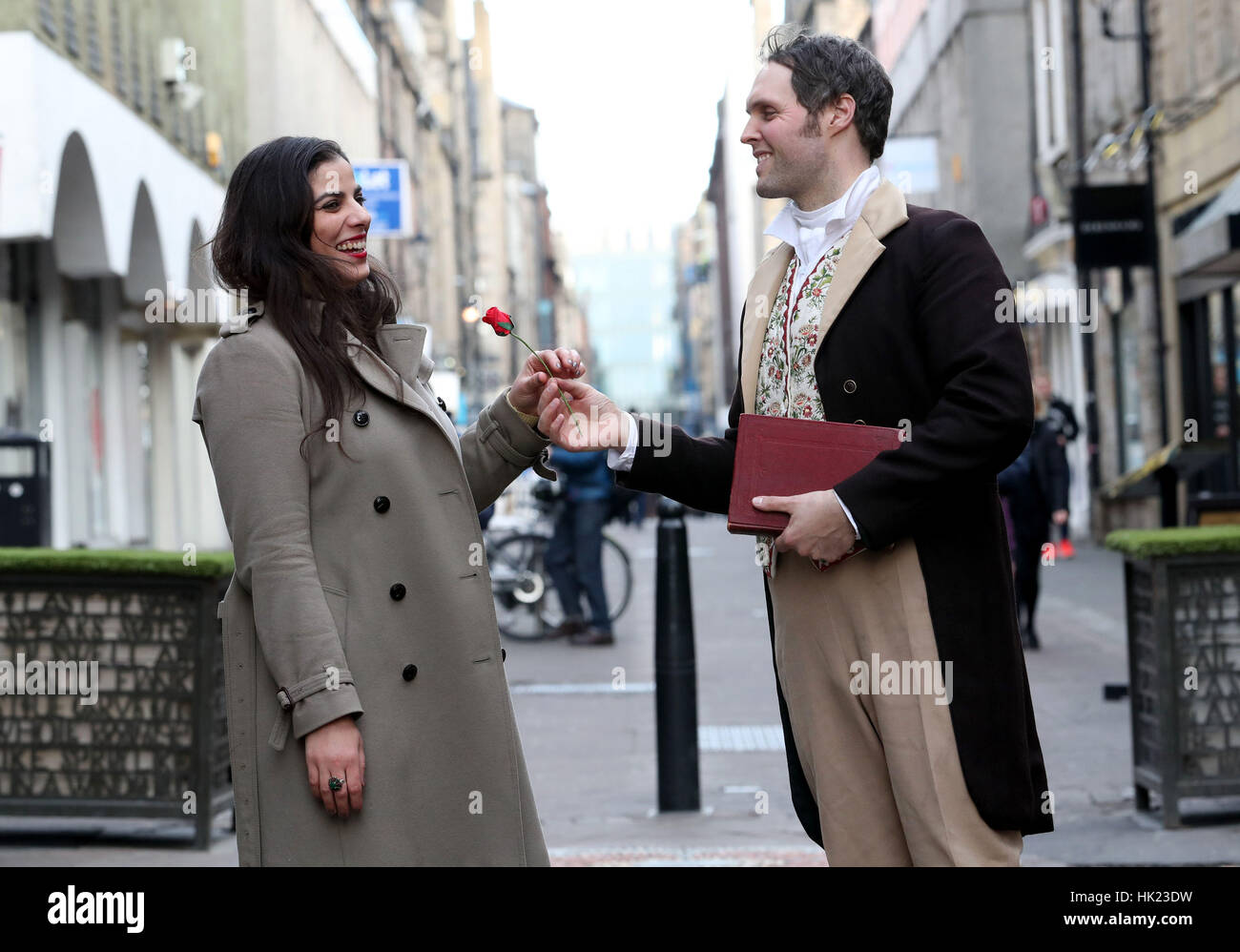 Actor Gareth Morrison, dressed as Robert Burns, gives Nissa Lima, from ...