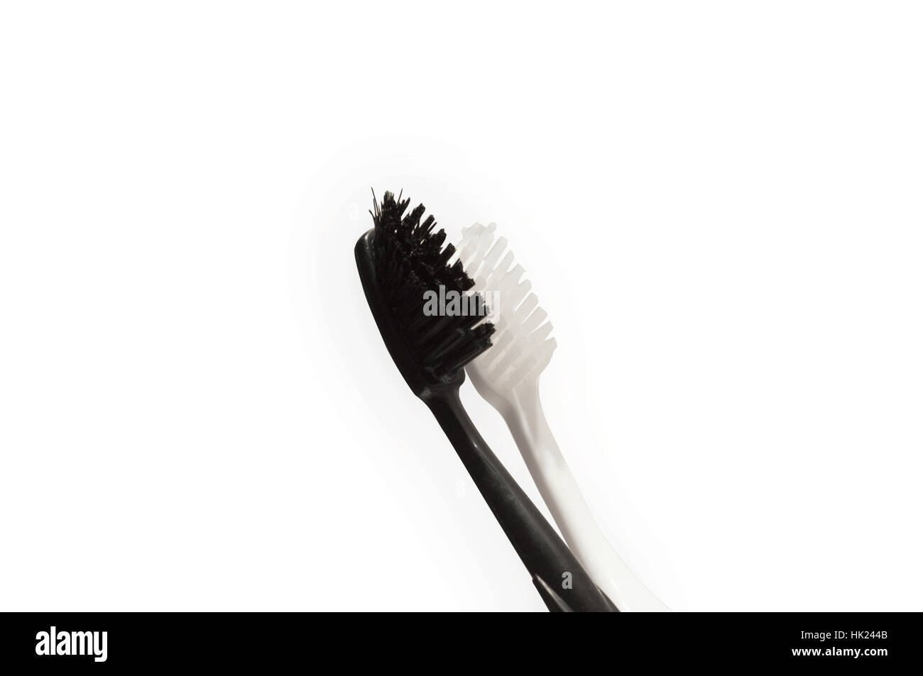 A white and black toothbrushes on isolated white background Stock Photo ...