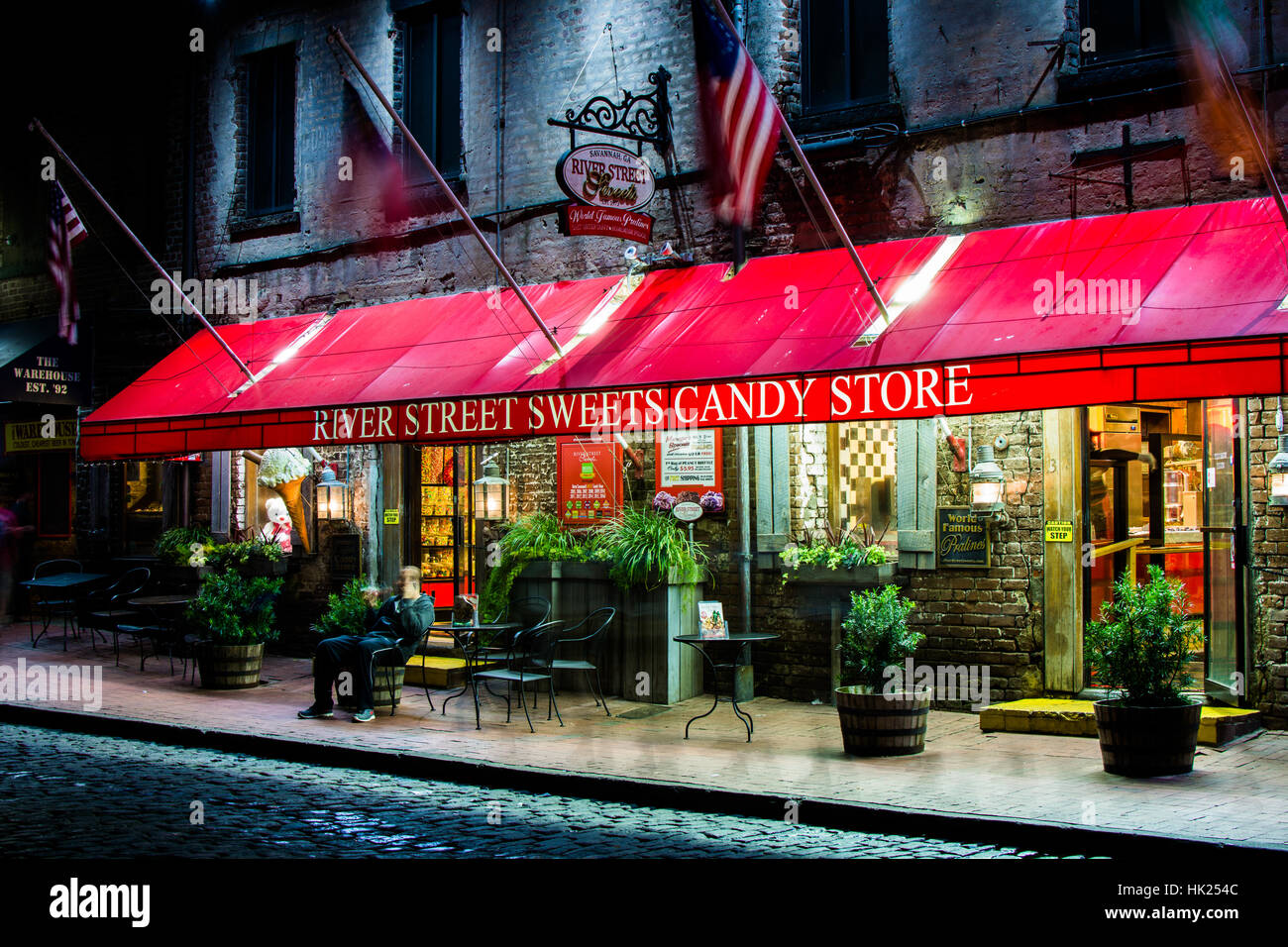 Candy store on River Street at night, in Savannah, Georgia Stock Photo ...