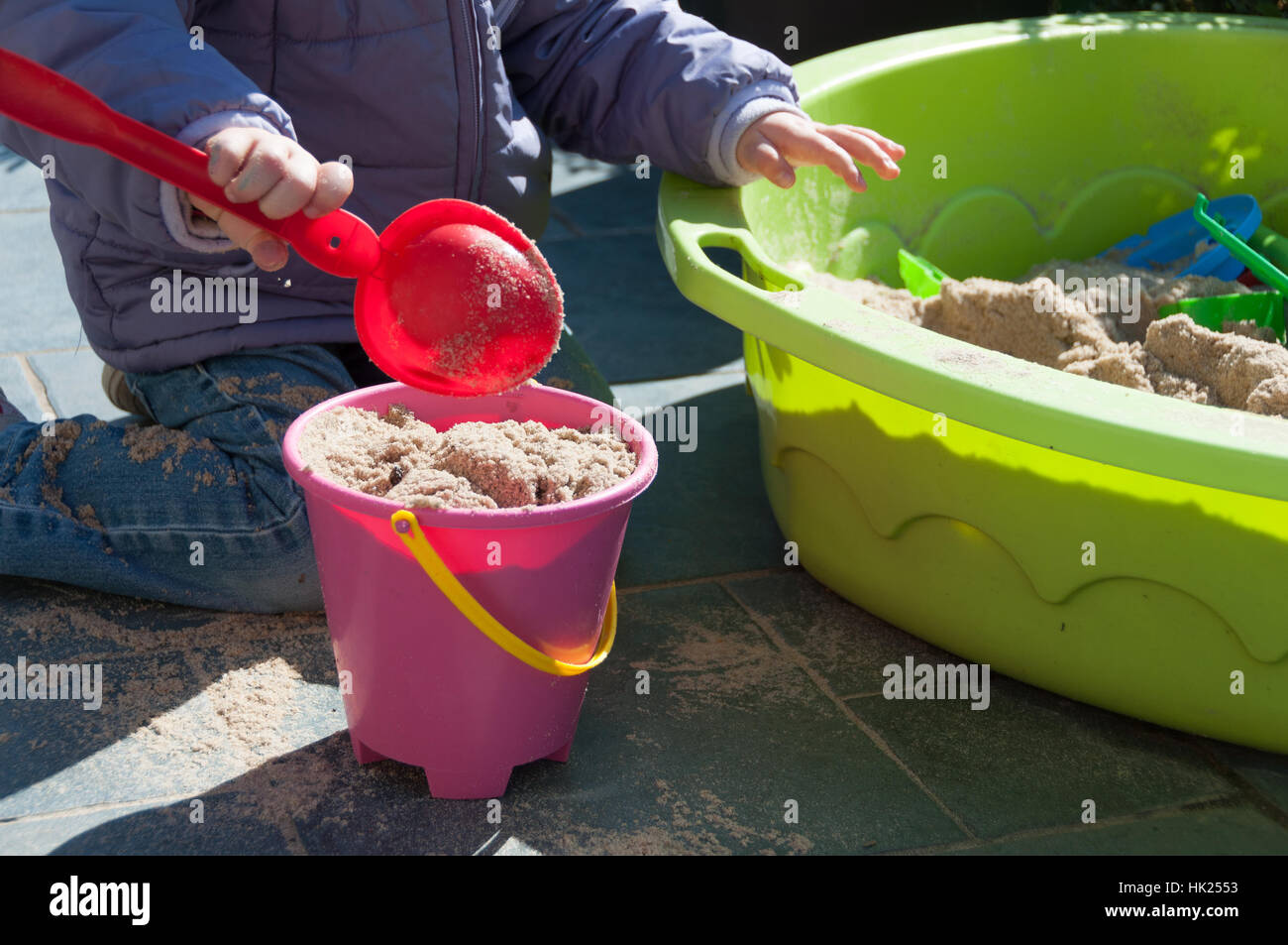 Child playing in sandbox Stock Photo - Alamy