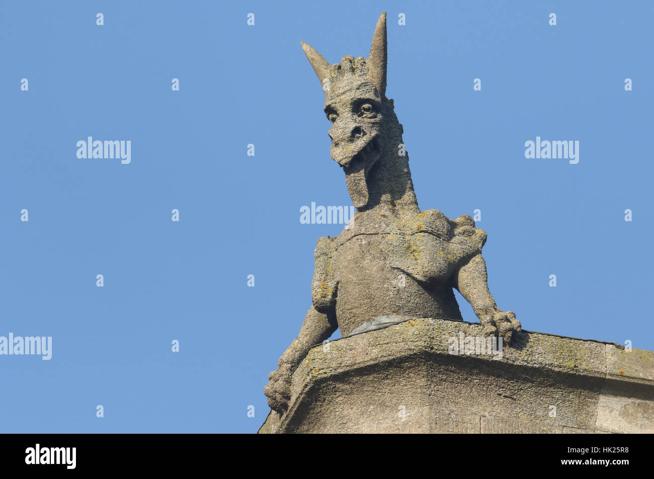 A Gargoyle/ Grotesque against a blue sky Stock Photo - Alamy