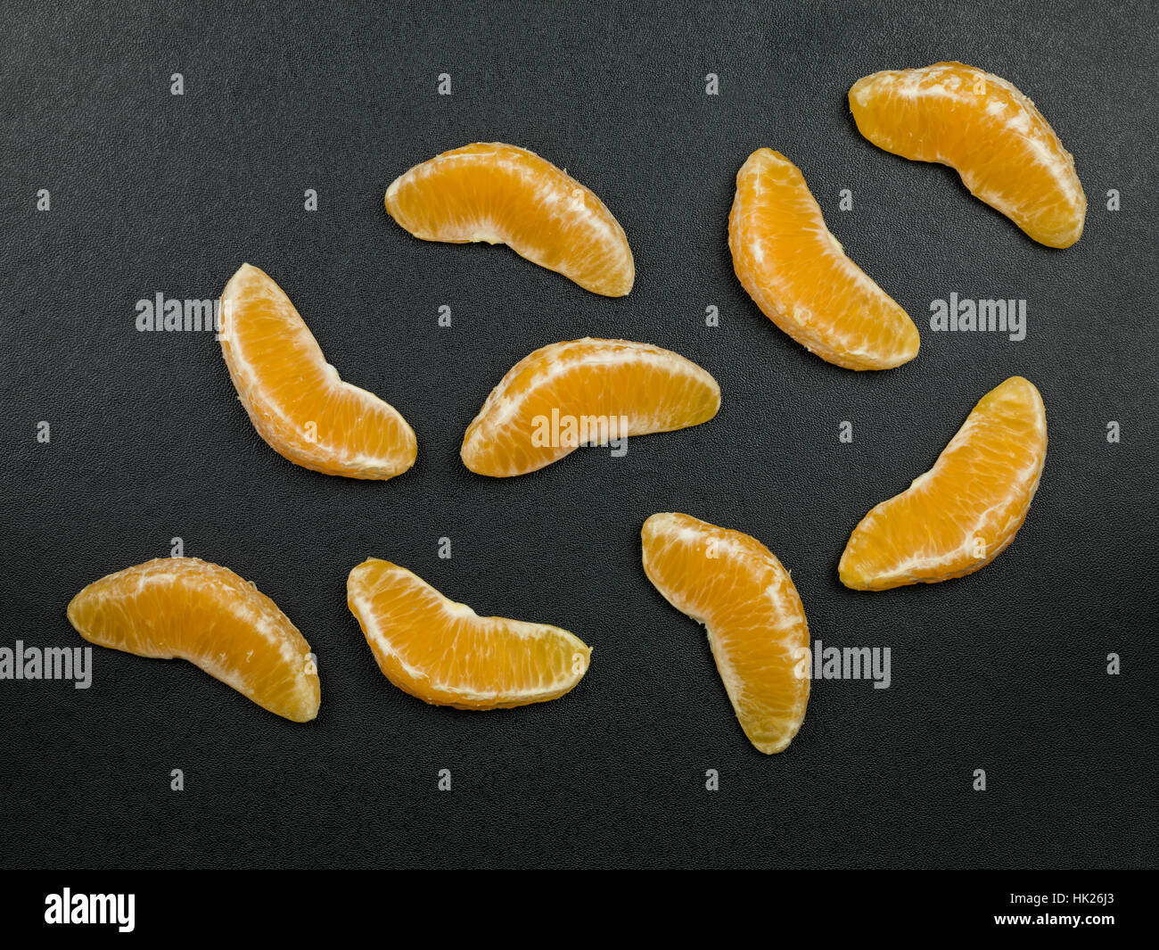 Fresh Fruit Orange Segments on a Black Background With Copy Space Stock ...