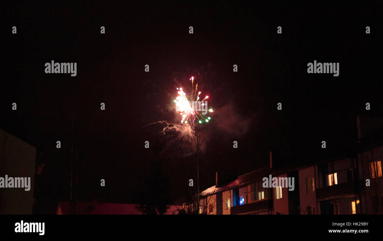 fireworks in the night sky over houses Stock Photo - Alamy