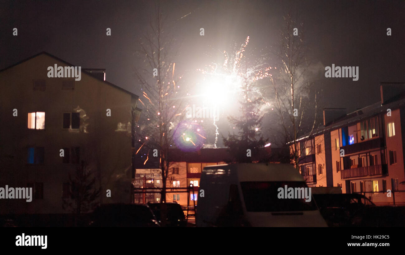 fireworks in the night sky over houses Stock Photo - Alamy
