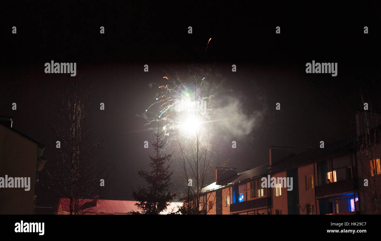 fireworks in the night sky over houses Stock Photo - Alamy