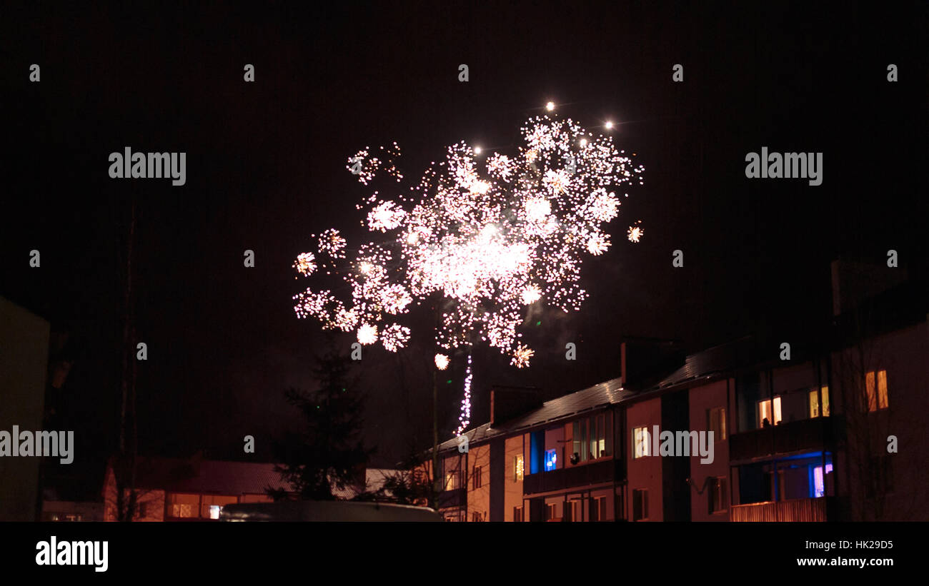 fireworks in the night sky over houses Stock Photo - Alamy