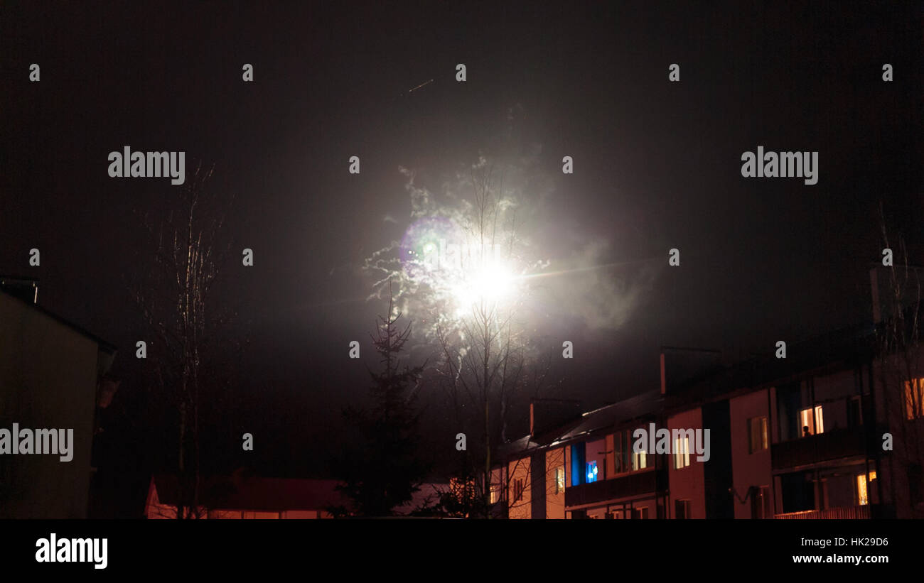 fireworks in the night sky over houses Stock Photo - Alamy