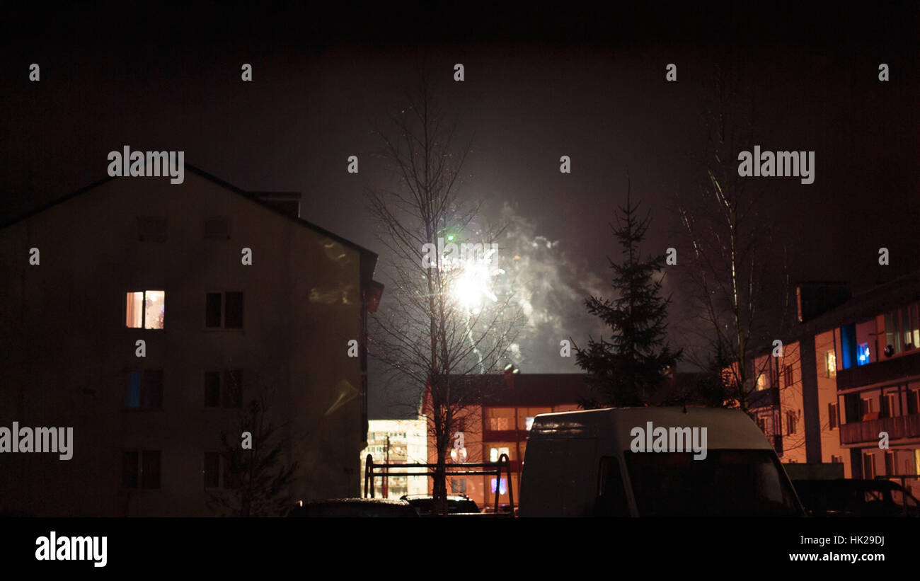 fireworks in the night sky over houses Stock Photo - Alamy