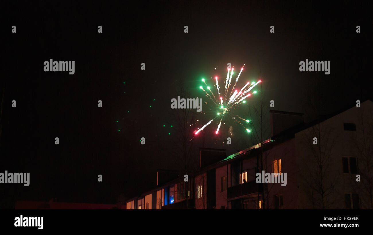 fireworks in the night sky over houses Stock Photo - Alamy