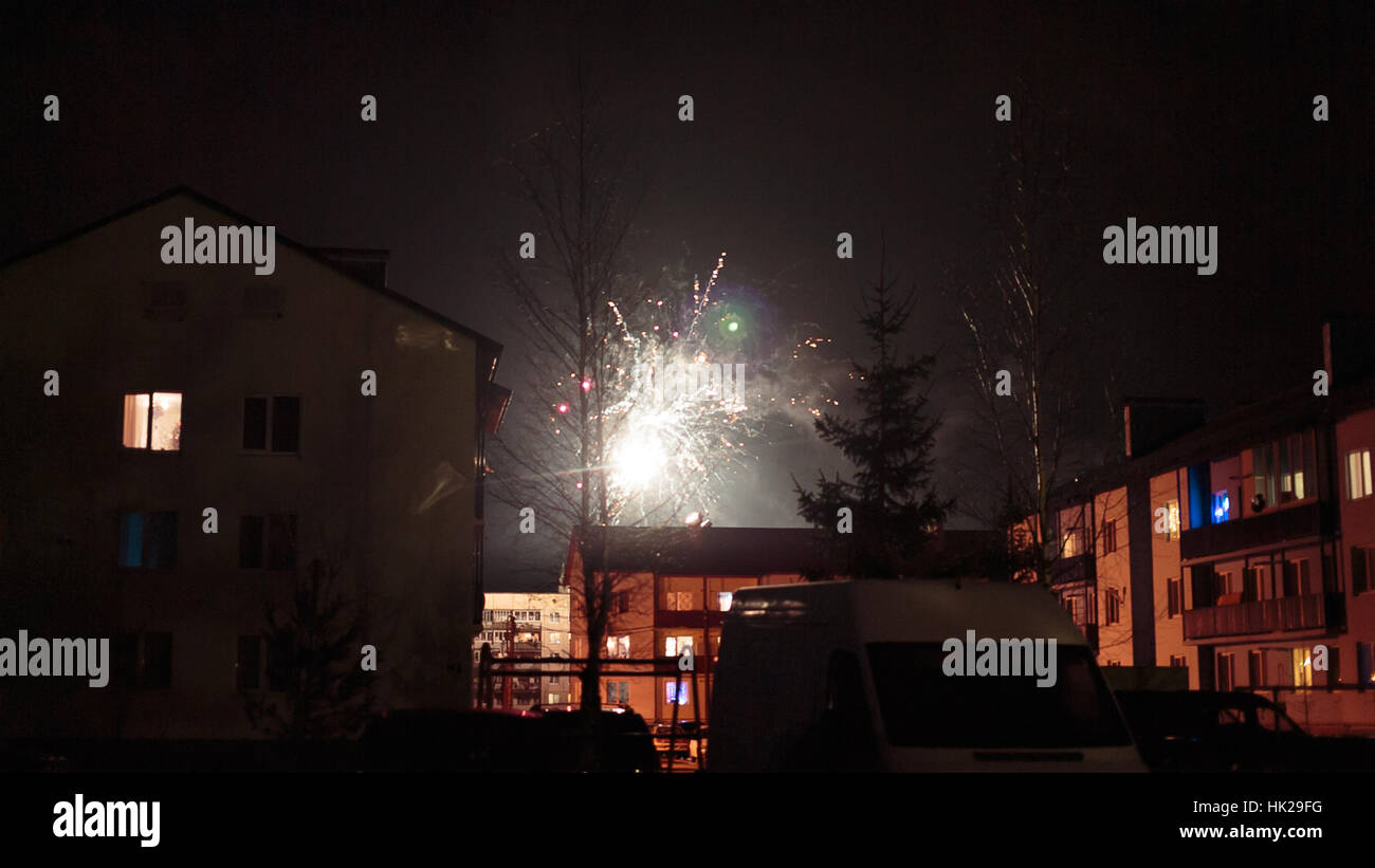 fireworks in the night sky over houses Stock Photo - Alamy