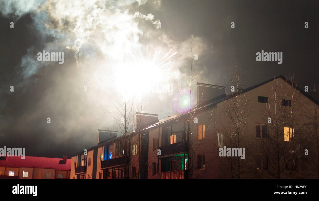 fireworks in the night sky over houses Stock Photo - Alamy