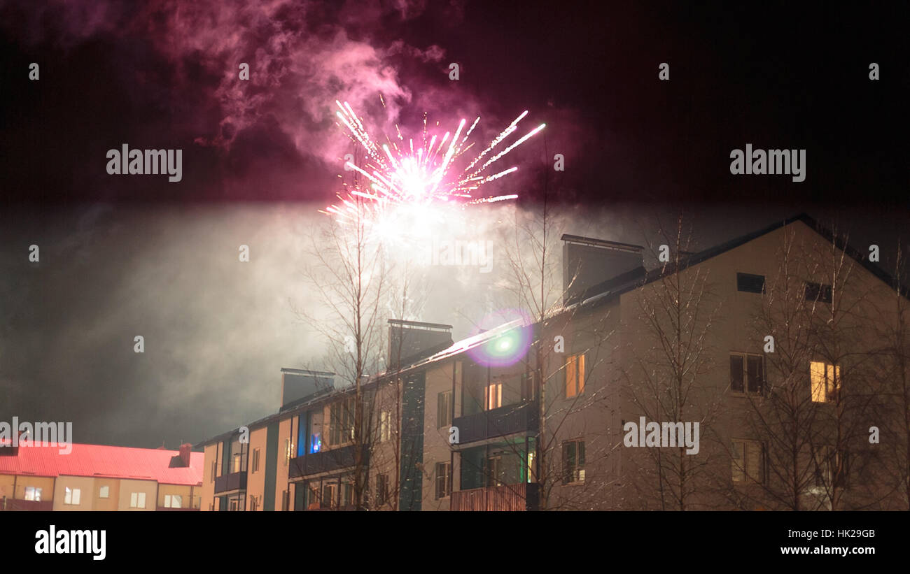 fireworks in the night sky over houses Stock Photo - Alamy