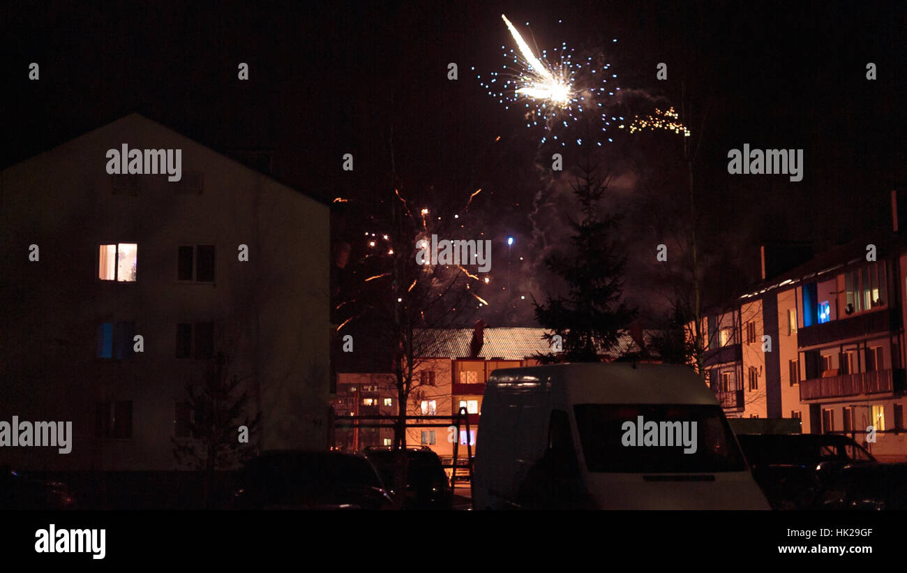 fireworks in the night sky over houses Stock Photo - Alamy
